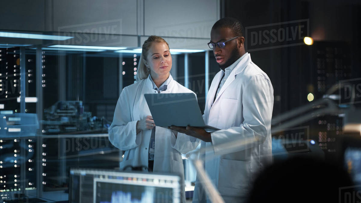 Engineer and Scientist Standing In High-Tech Laboratory - Royalty-free ...
