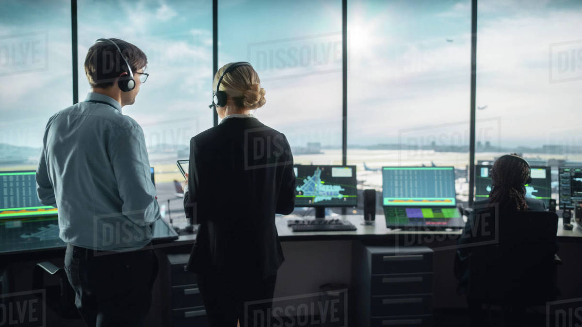 Diverse Air Traffic Control Team Working in a Modern Airport Tower ...
