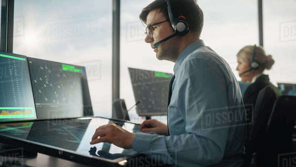 Diverse Air Traffic Control Team Working in a Modern Airport Tower ...