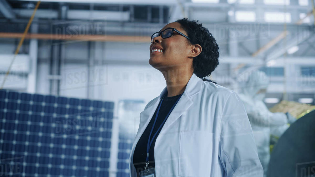 Brilliant Female Engineer Looking Around in Wonder at the Aerospace ...