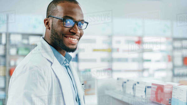 Portrait of Professional Black Pharmacist Uses Digital Tablet Computer ...