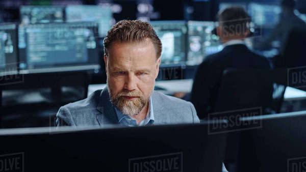 Portrait of Positive Professional Technical Controller Sitting at His ...