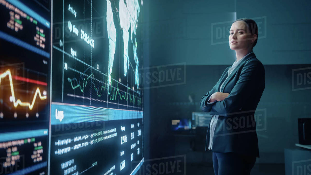 Young Female Computer Science Engineer Looking at Big Screen Display ...