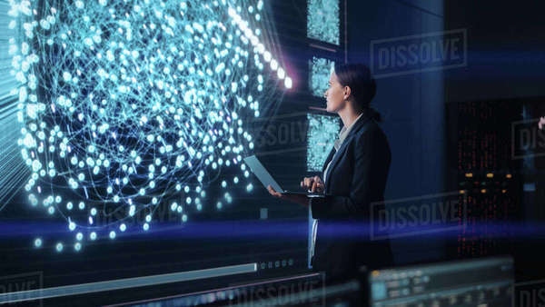 Young Female Computer Science Engineer Working on Laptop next at Big ...