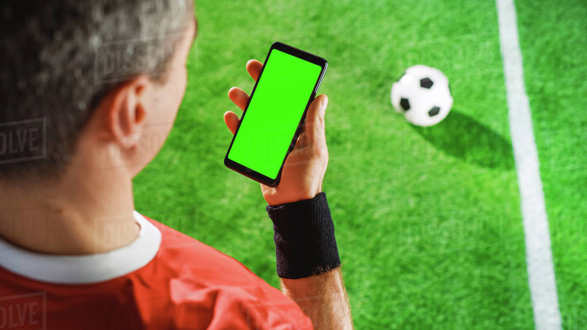 Professional Soccer Player Holding Smartphone with Green Screen Chroma ...
