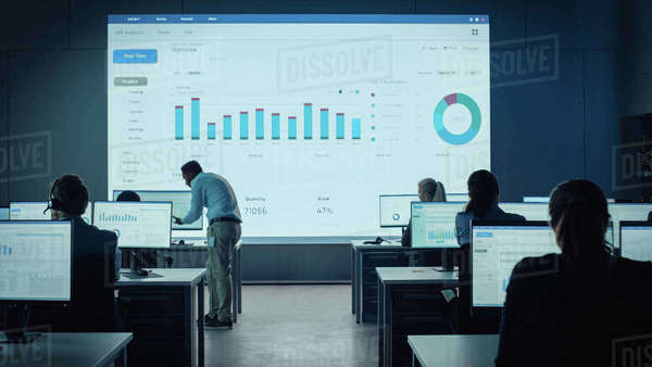 Professional Traders Working in a Modern Monitoring Office with Live ...