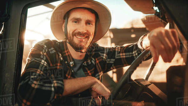 Desert Road Trip: Portrait of Handsome Male Explorer Looking out of Car ...