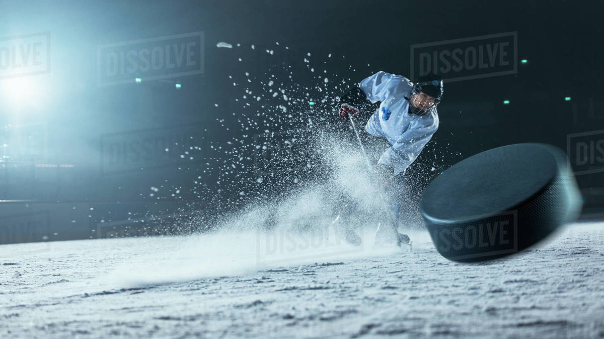 Ice Hockey Rink Arena: Professional Player Shooting the Puck with ...