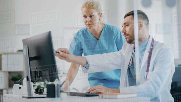 Hospital Medical Doctor Office: Head Nurse Consults Physician with ...