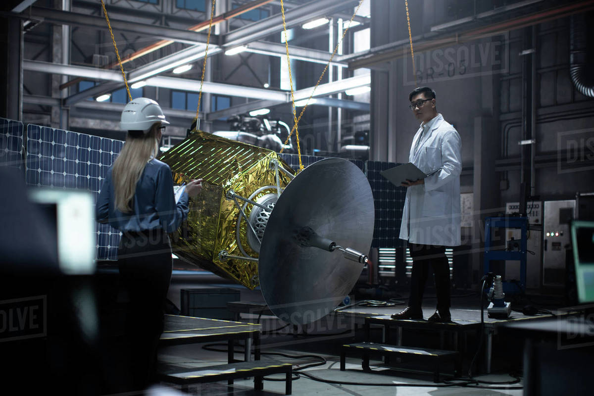 Engineer and Technician Working on Satellite Construction. Aerospace ...