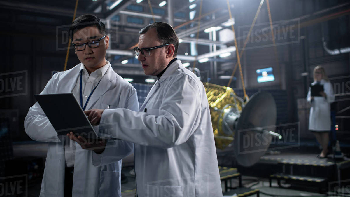 Engineer and Technician Working on Satellite Construction. Aerospace ...