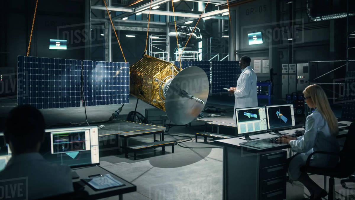Team of Engineers Working on Satellite Construction. Aerospace Agency ...