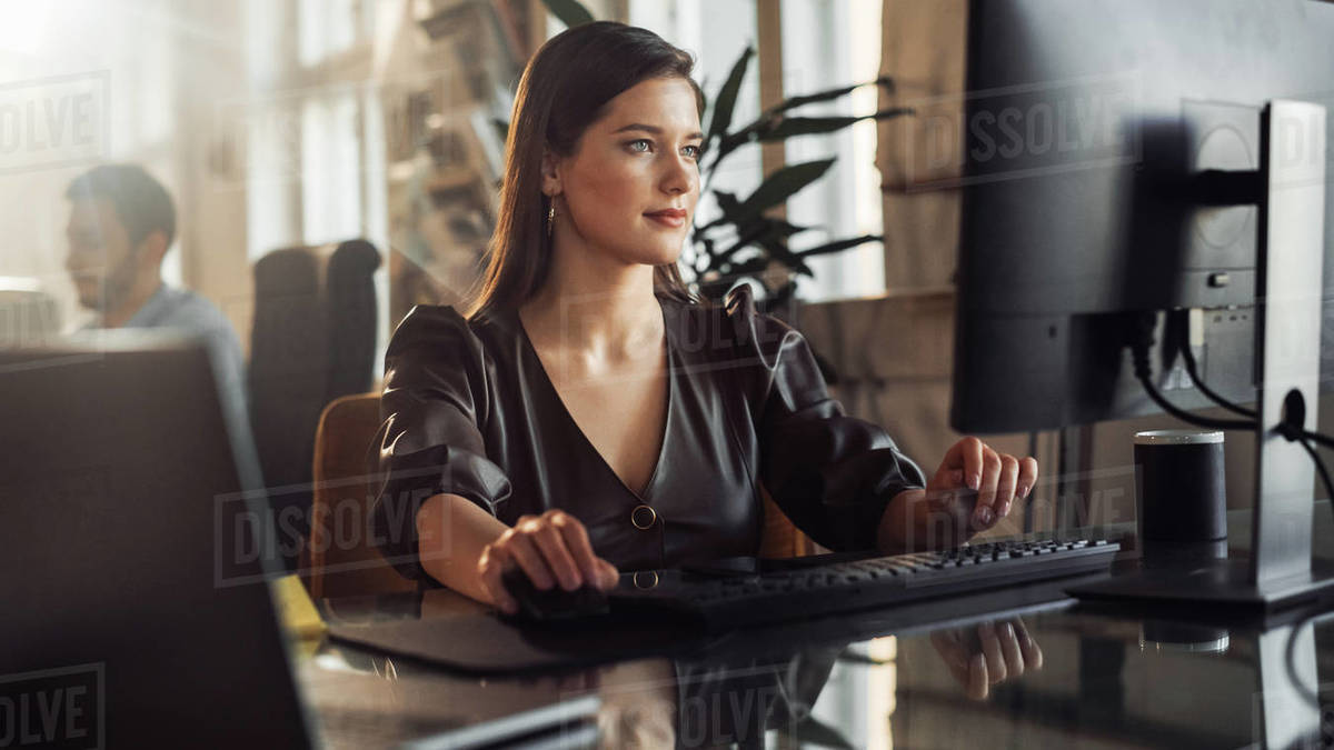Portrait Shot of a Stylish Employee Working on Computers in Creative ...