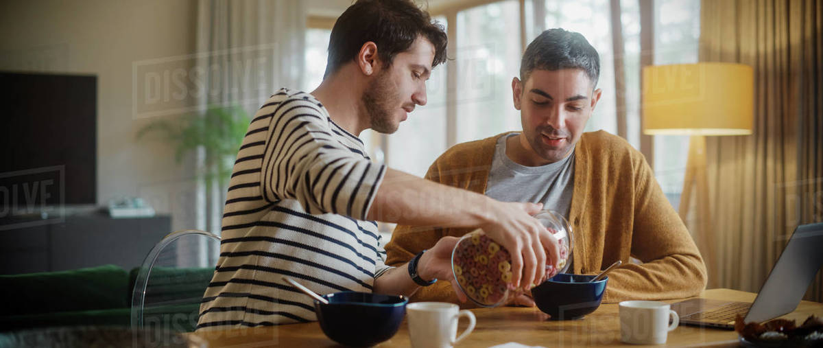 Two Friends Eating Breakfast Cereal in Cozy Kitchen in Stylish ...