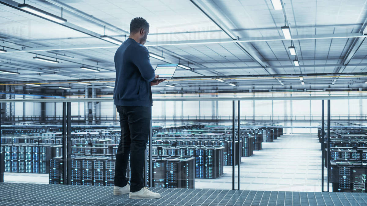 Data Center Engineer Using Laptop Computer - Royalty-free Stock Photo ...
