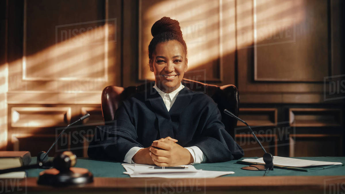Impartial Female Judge Looking at Camera - Stock Photo - Dissolve