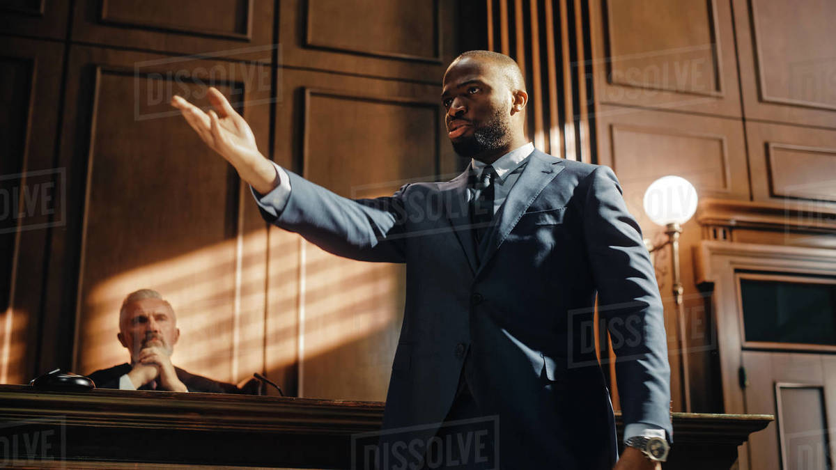 Male Public Defender Presenting the Case - Stock Photo - Dissolve