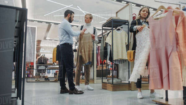 Customer Shopping in Clothing Store - Stock Photo - Dissolve