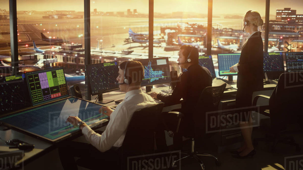 Diverse Air Traffic Control Team Working in a Modern Airport Tower at ...