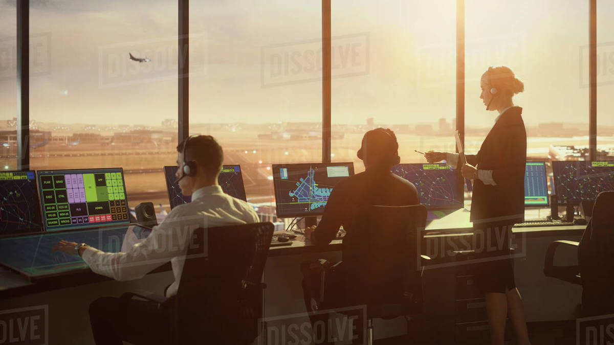 Diverse Air Traffic Control Team Working in a Modern Airport Tower at ...