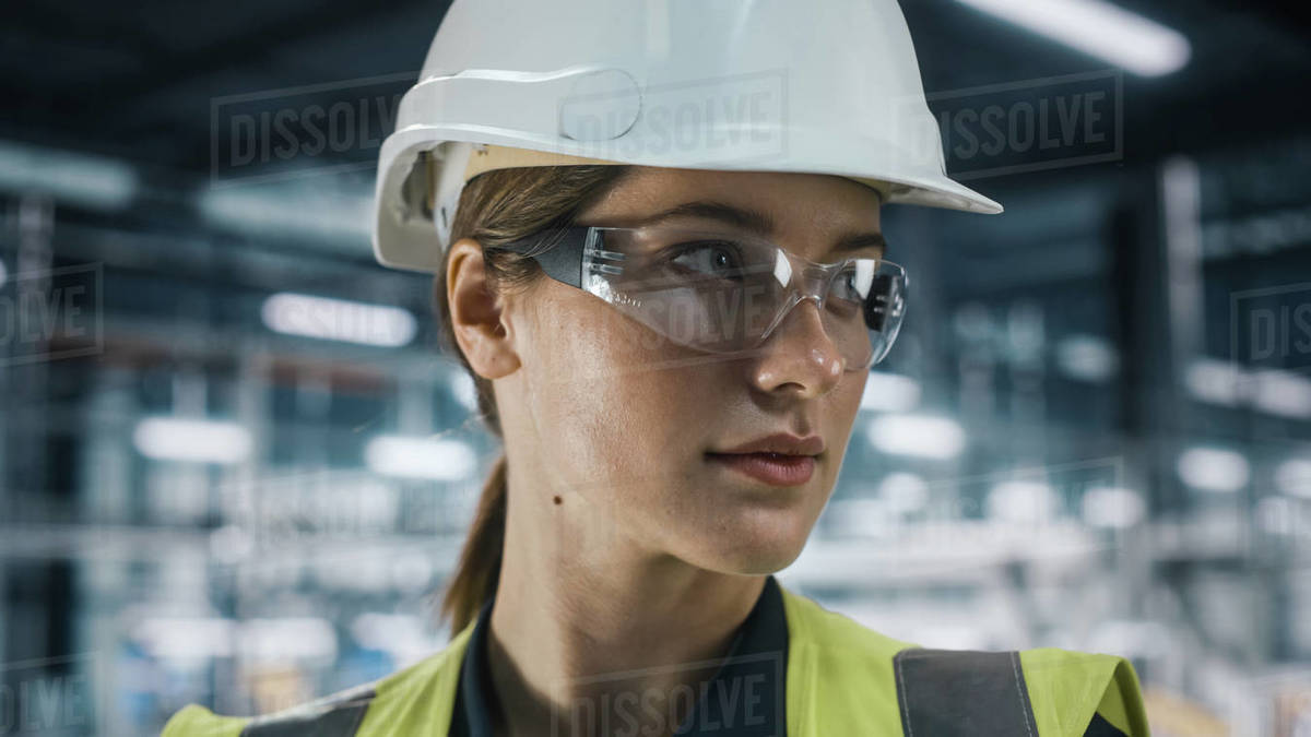 Portrait of Female Automotive Industry Engineer Wearing Safety Glasses ...