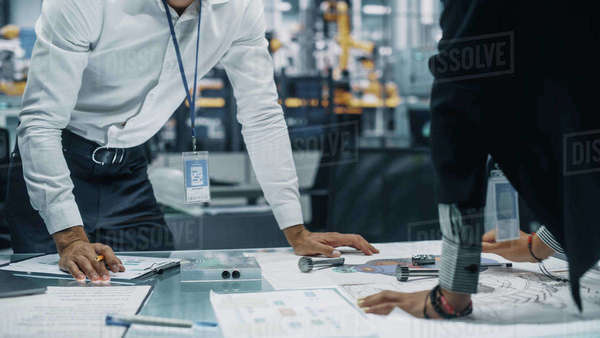 Two Young Automotive Engineers Working in Office at Car Factory ...