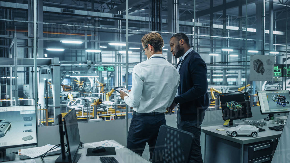 Two Diverse Automotive Industrial Engineers Talking About Vehicle ...