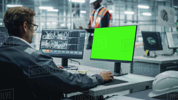 Vehicle Factory Line Operator Working at Desk with Computer with Green ...