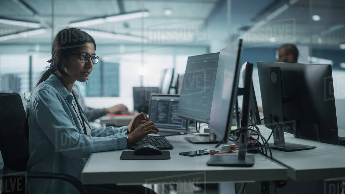 Diverse Office: Indian IT Programmer Working on Desktop Computer ...