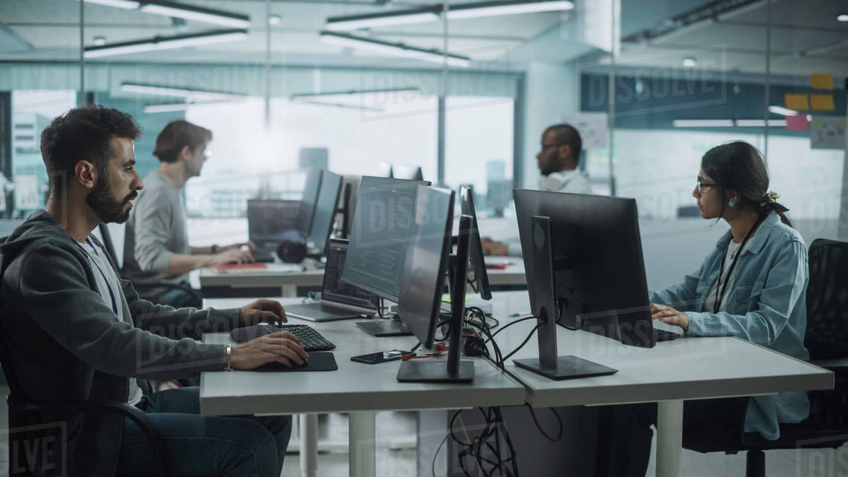 Diverse Multi-Ethnic Team Working in Big City Office: IT Programmers ...