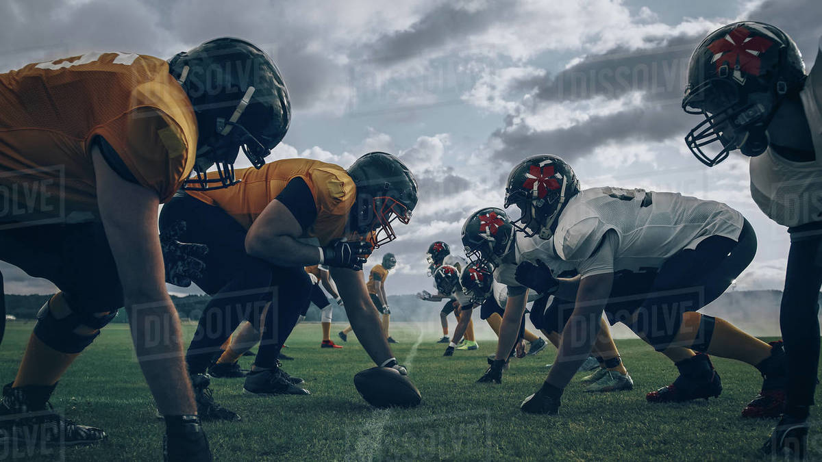 Two Professional American Football Teams Stand Opposite Each Other ...