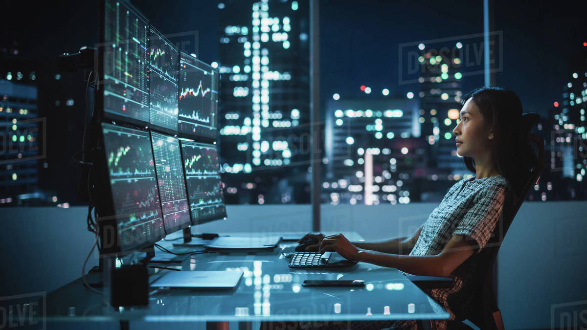 Portrait of a Financial Analyst Working on Computer with Multi-Monitor ...