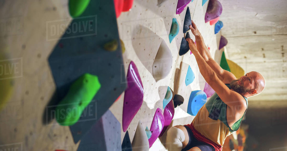 Strong Experienced Rock Climber Practicing Solo Climbing on Bouldering ...
