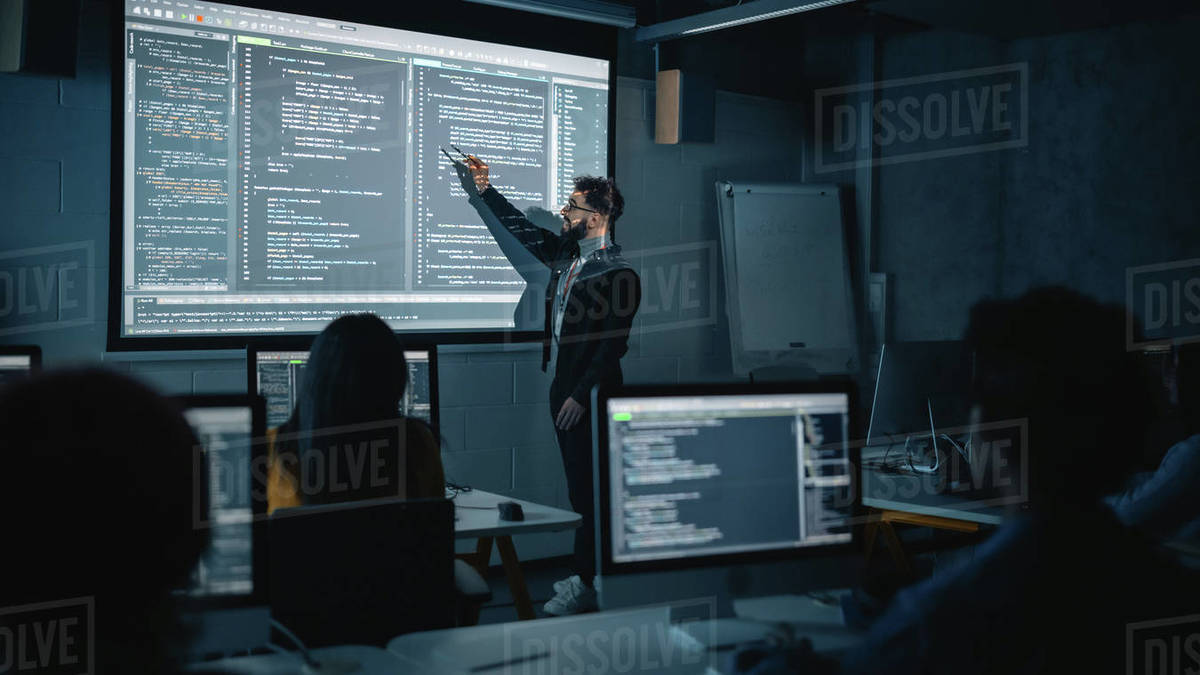 Teacher Giving Computer Science Lecture to Diverse Multiethnic Group of ...