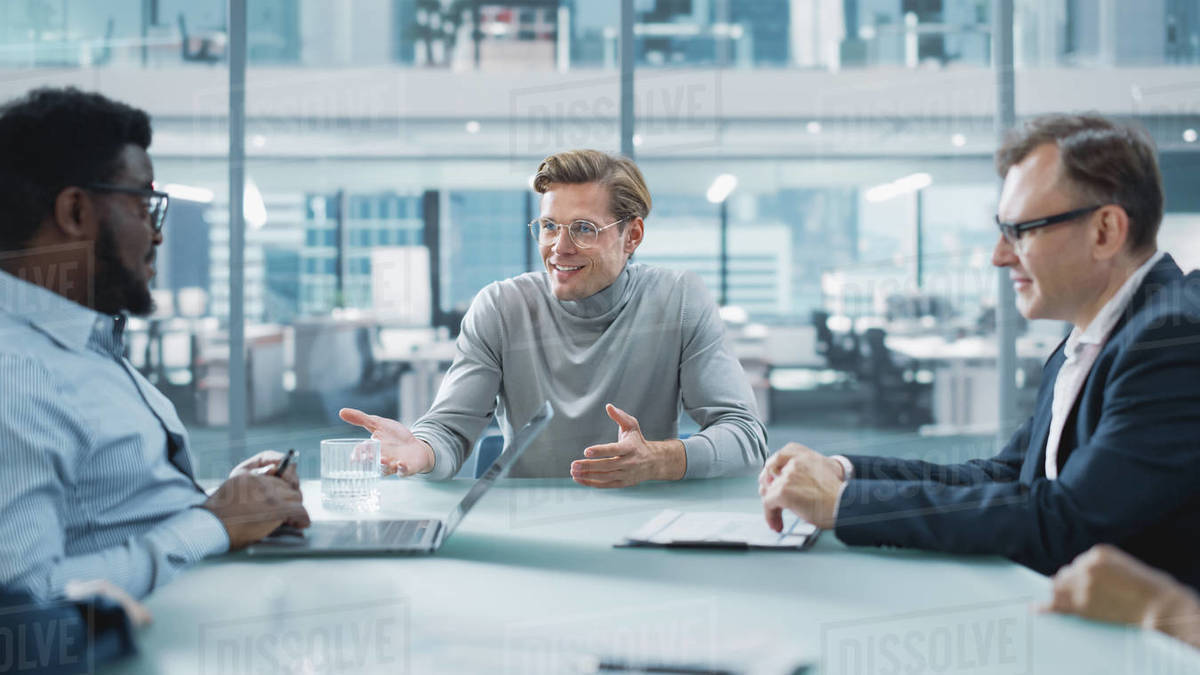 Director Sits in the Head of the Conference Table and Delivers Strong ...