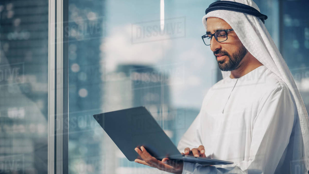 Muslim Businessman in Traditional White Kandura Standing in His Modern ...