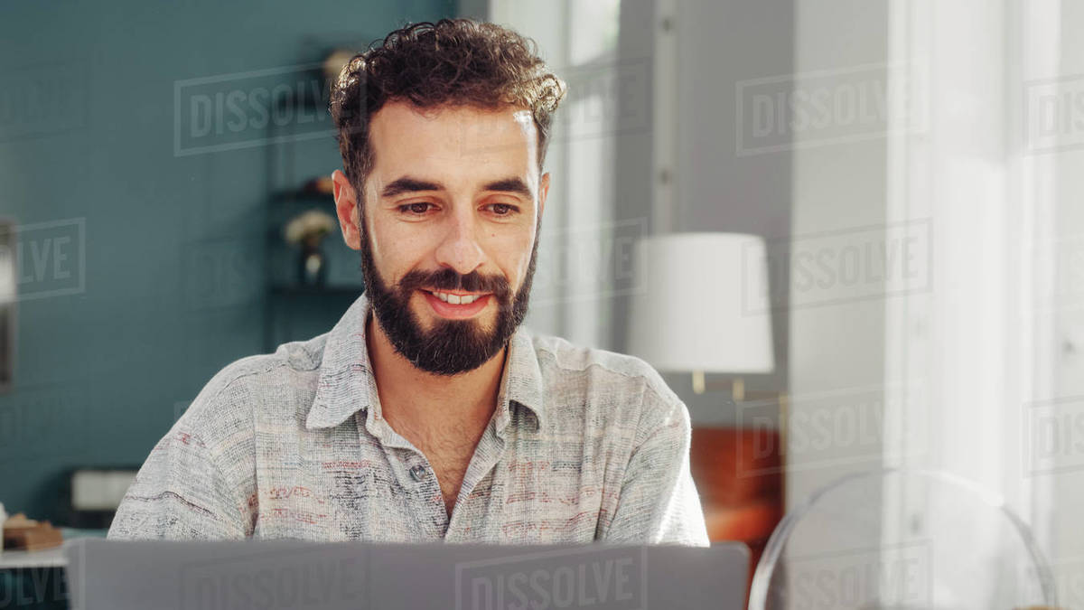 Adult Man with Dark Hair Using Laptop Computer - Royalty-free Stock ...