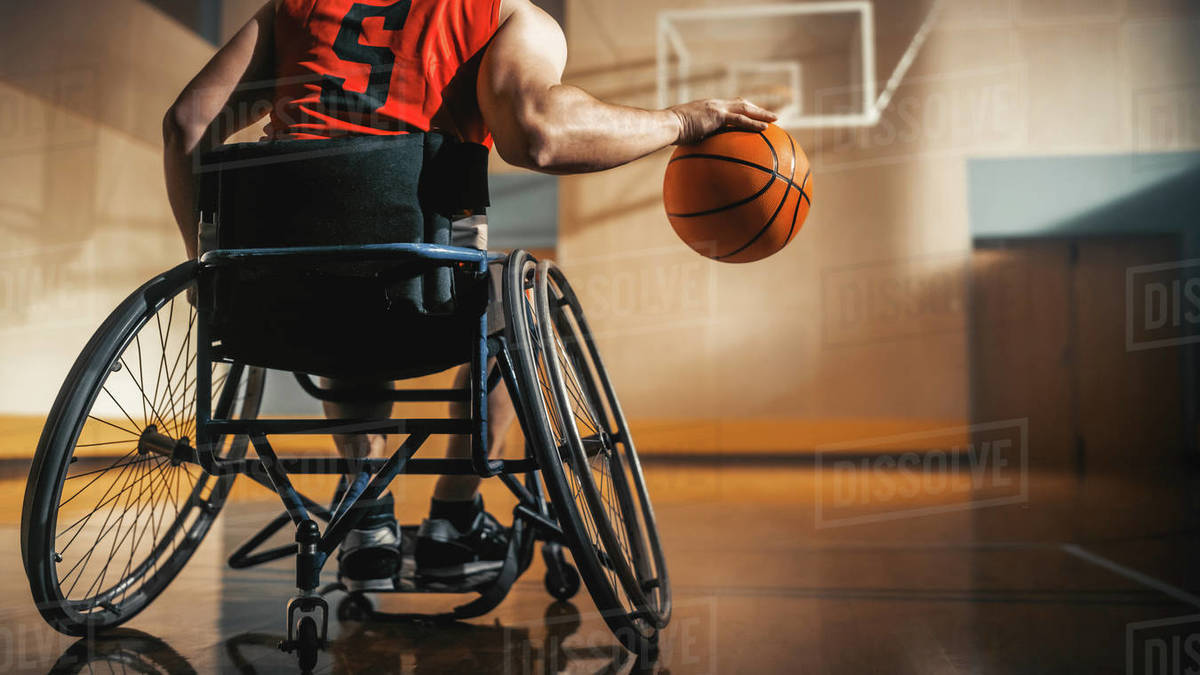 Wheelchair Basketball Player Wearing Red Shirt Dribbling Ball Like a ...