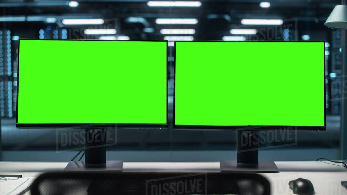 Professional IT Programer Working in Data Center on Desktop Computer with Two Displays, while ...