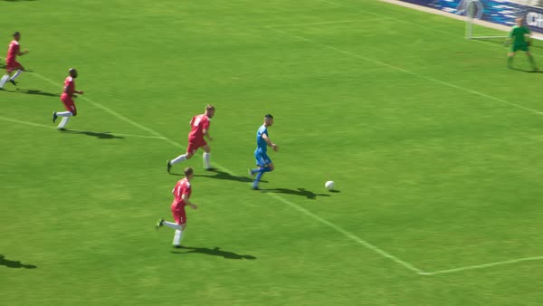 Football Championship: Blue Team Forward Attacks, Kicks the Ball and ...