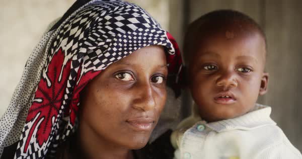 Portrait of a Beautiful African Young Mother in Traditional Clothes ...