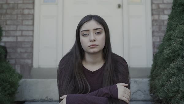 Girl with attitude sitting on front stoop - 4K Rights-managed Stock ...