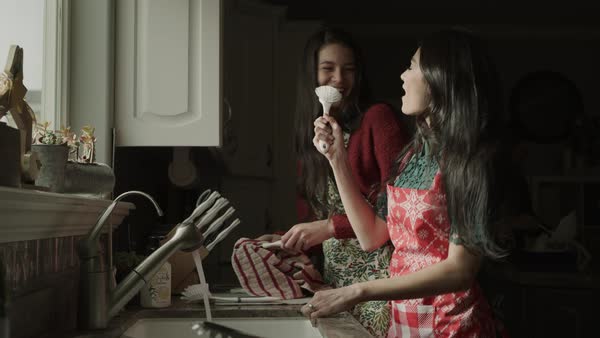 Women singing and dancing while washing dishes at kitchen sink - 4K ...