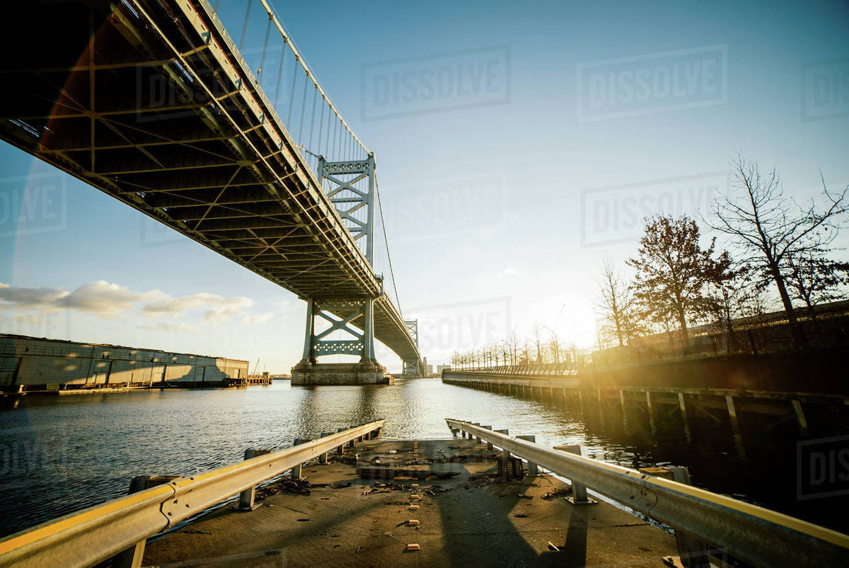 Benjamin Franklin Bridge and Race Street Pier during sunset ...