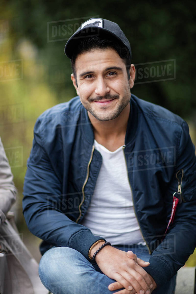 Young man looking at camera - Stock Photo - Dissolve