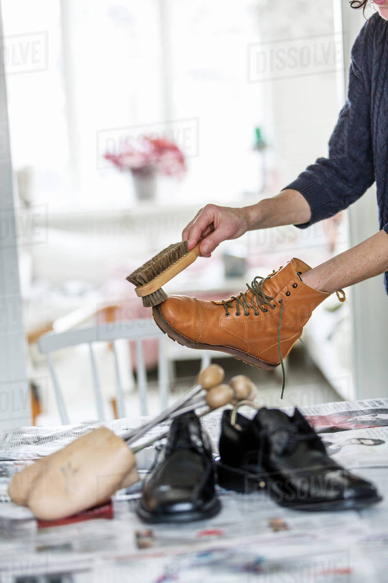 Person polishing shoes - Stock Photo - Dissolve