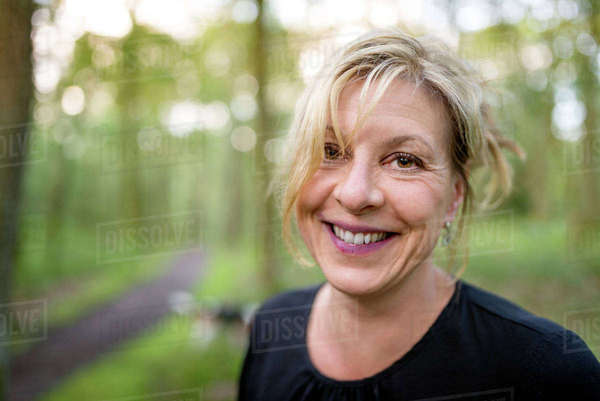 Portrait of smiling woman - Royalty-free Stock Photo | Dissolve