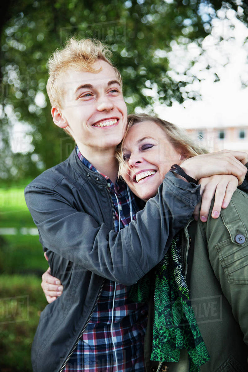 Young man with mother - Royalty-free Stock Photo | Dissolve