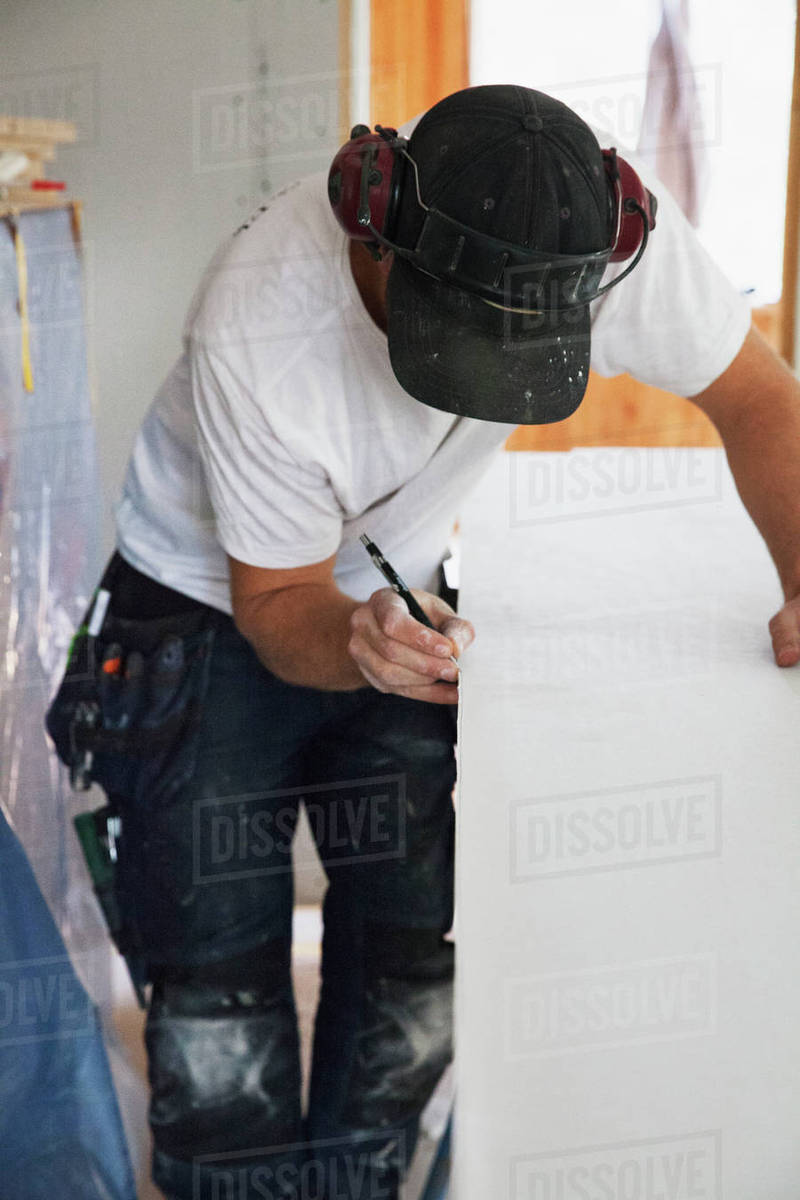 Man renovating house - Royalty-free Stock Photo | Dissolve
