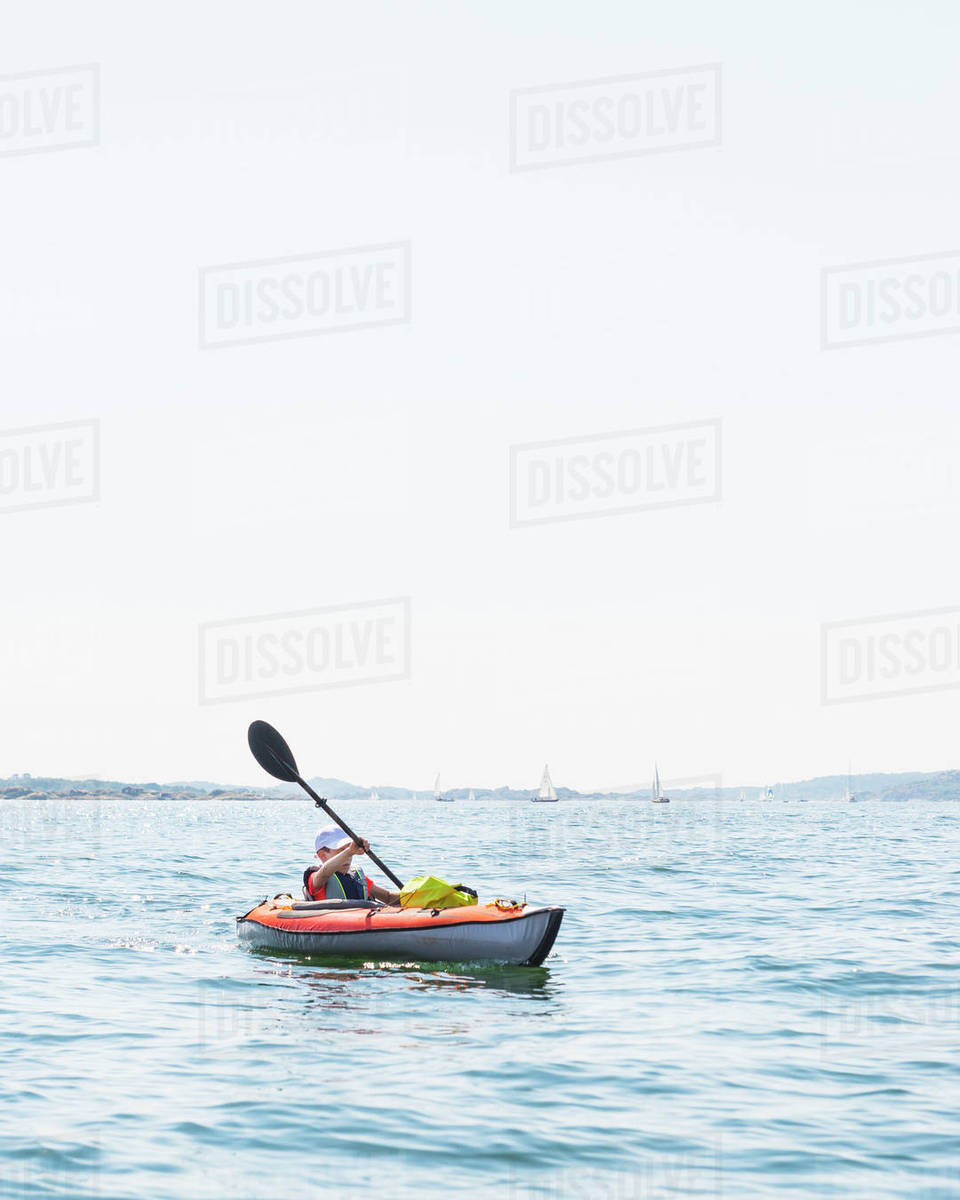 Boy kayaking - Royalty-free Stock Photo | Dissolve